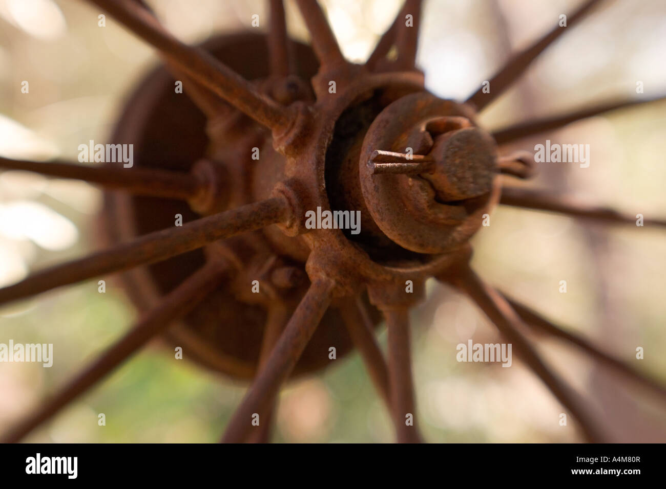 The rusted spokes, nuts and bolts of an old metal wagon wheel Stock ...
