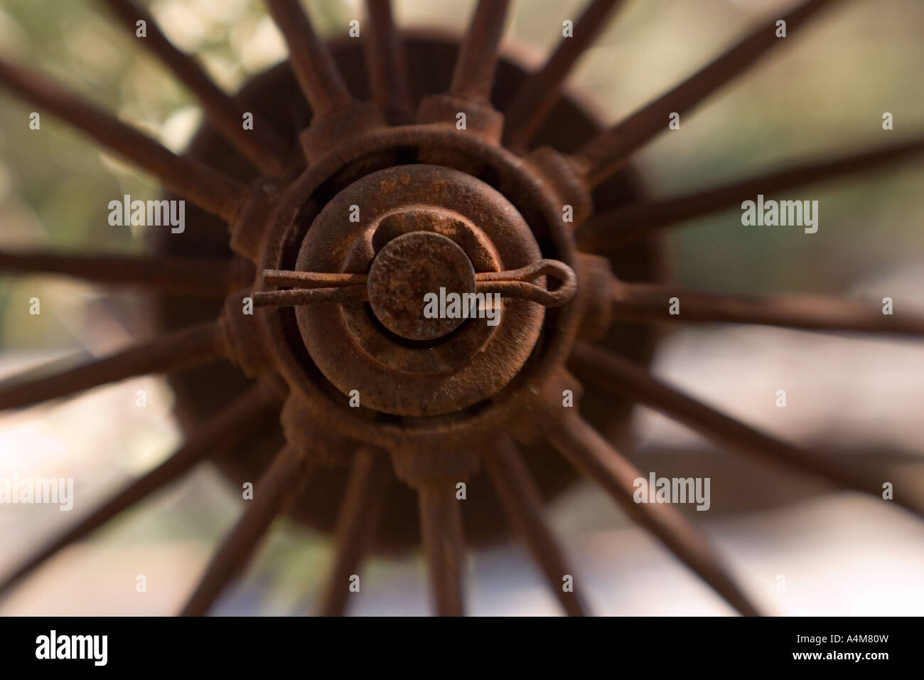 The rusted spokes, nuts and bolts of an old metal wagon wheel Stock ...