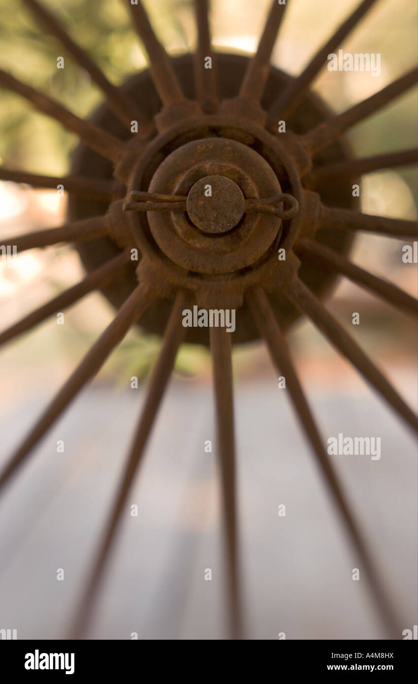 The rusted spokes of an antique iron wagon wheel Stock Photo - Alamy