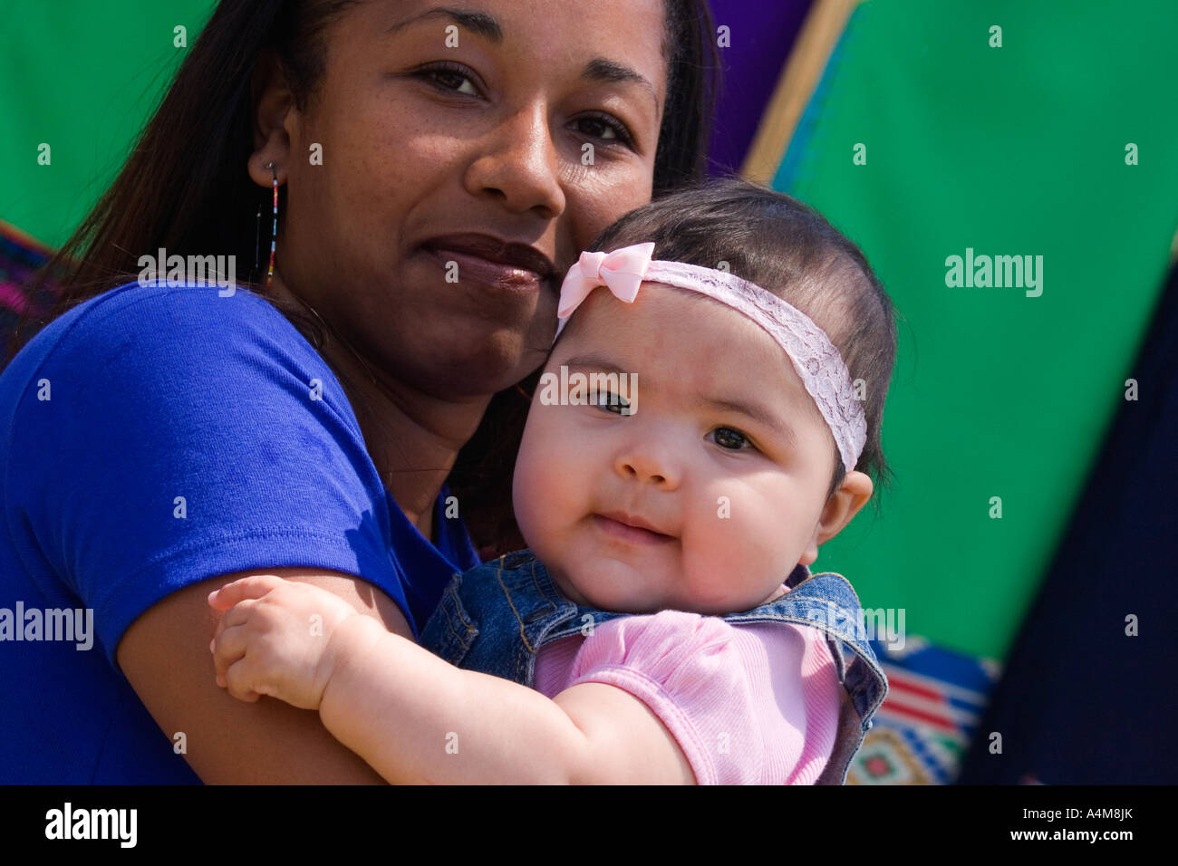 A Native American woman holding her baby daughter Stock Photo - Alamy