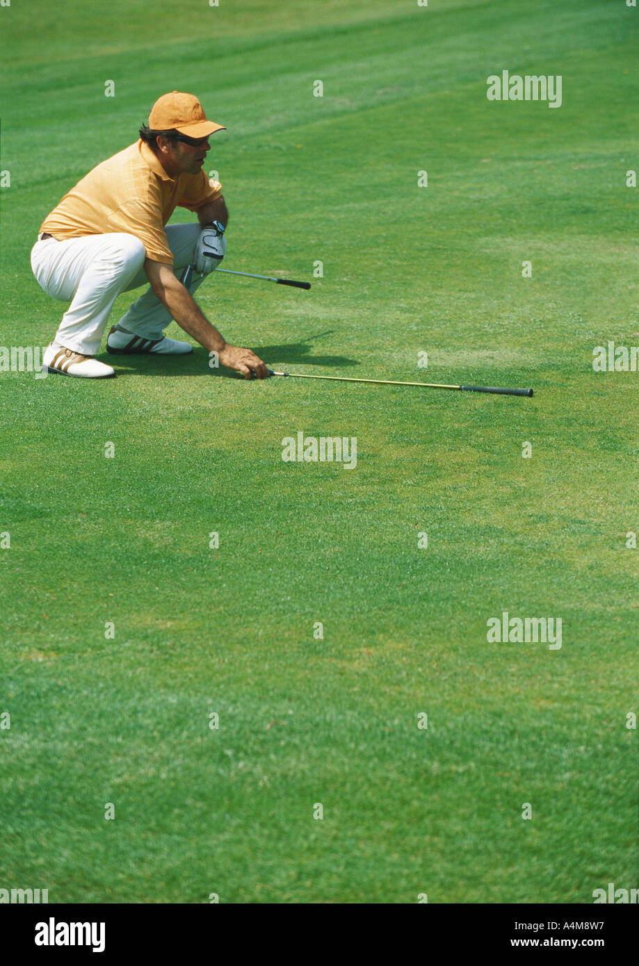 Golfer squatting on green hi-res stock photography and images - Alamy