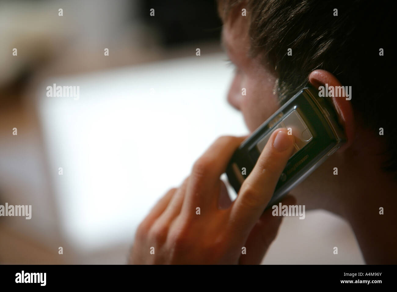 DEU Germany Man with a mobile phone in an office Stock Photo - Alamy