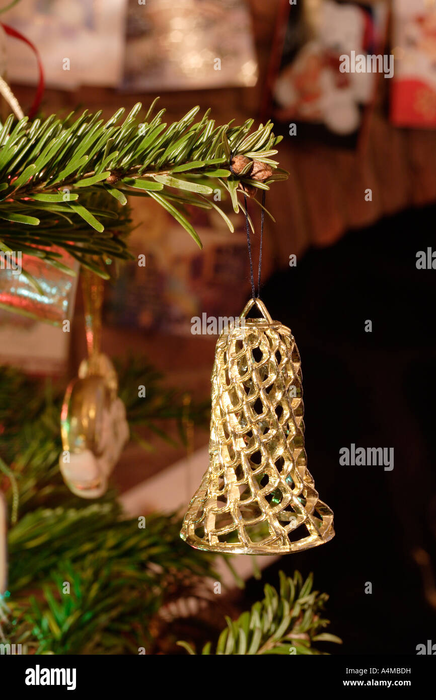 Gold bell Christmas decoration on tree Stock Photo - Alamy