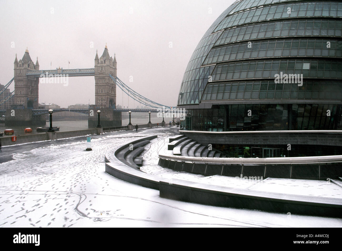 Tower Bridge and the Mayor's office building in London after a snowfall ...