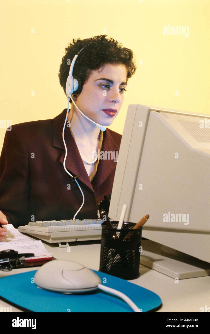 WOMAN (app. 30) TELE-MARKETING AT COMPUTER Stock Photo - Alamy