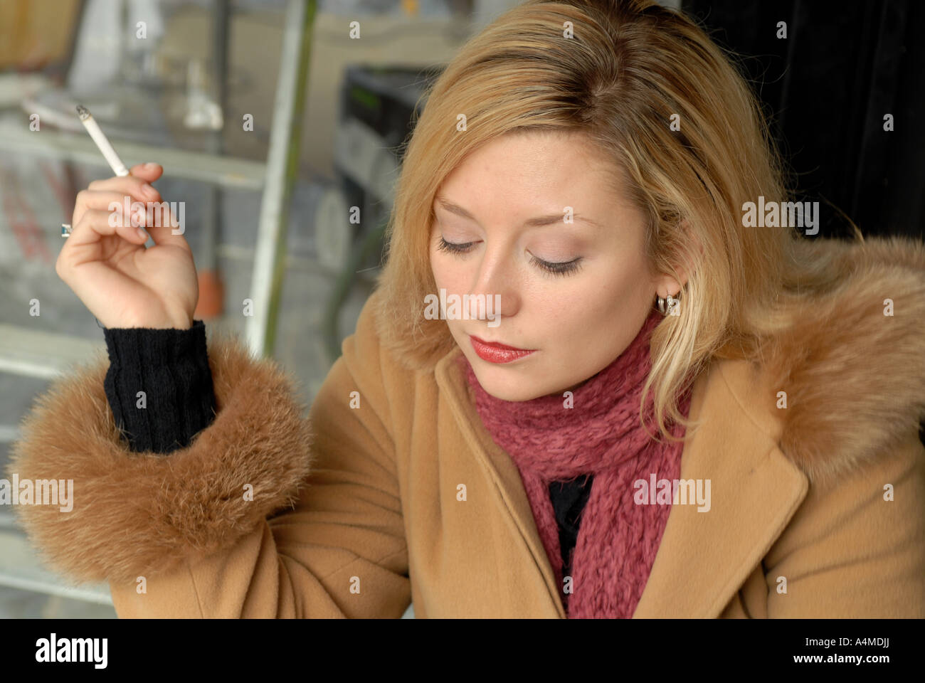 Blonde girl smoking hi-res stock photography and images - Alamy