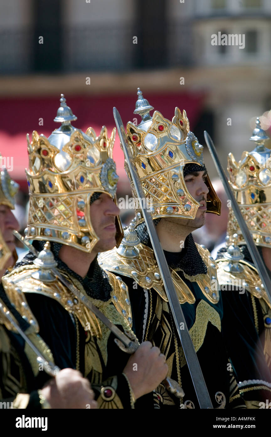 Men wearing ornate armour parade during Fiesta de la Virgen Blanca ...