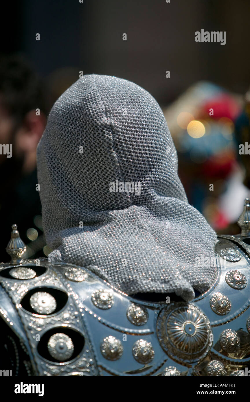 Rear view of man wearing chain mail and armour during parade, Fiesta de ...