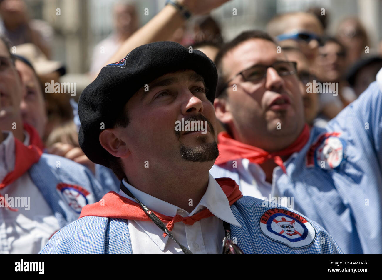 Basque man wearing traditional 'blusa' and beret looking up, church of ...