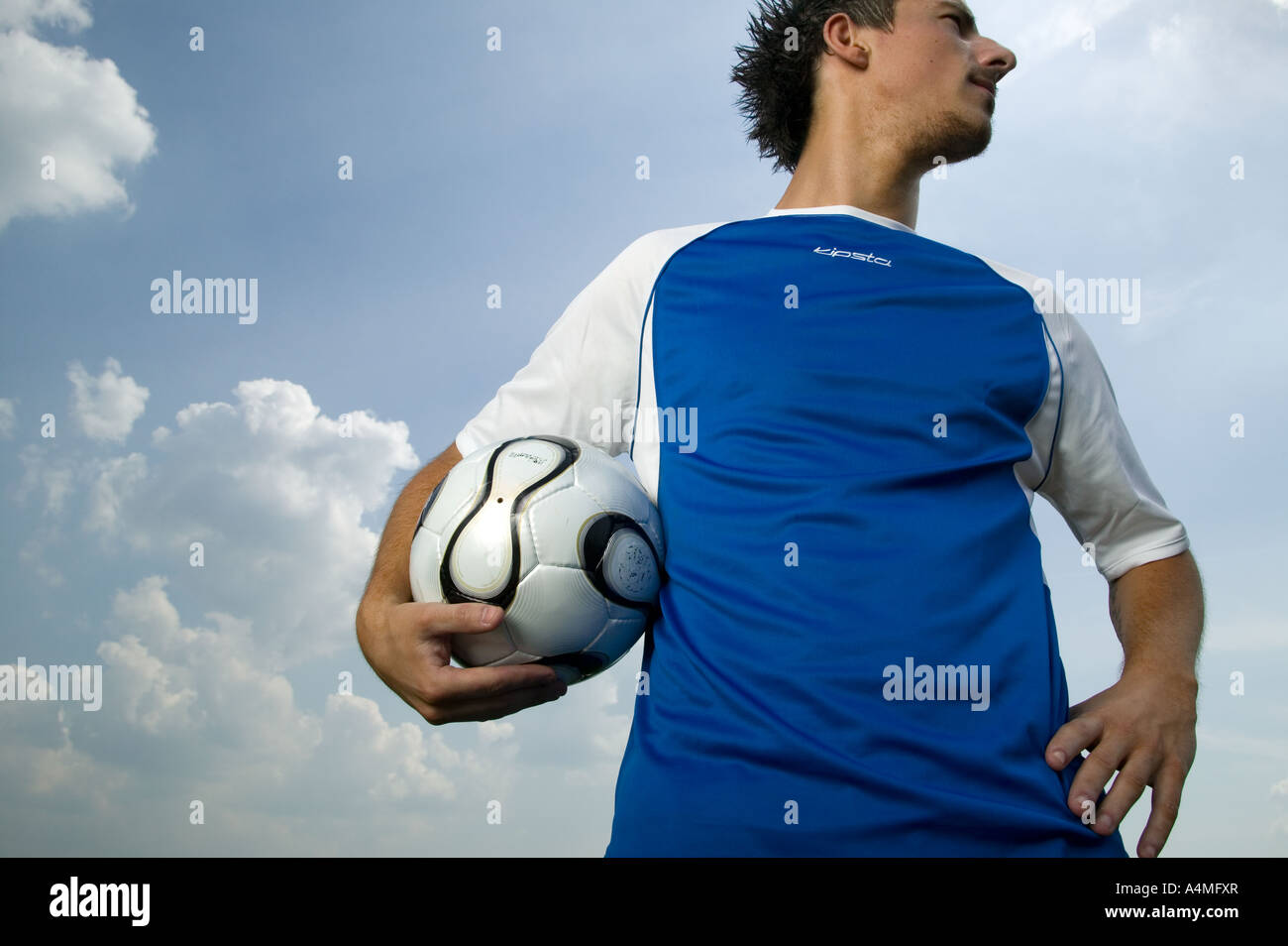 Soccer player holding ball under hi-res stock photography and images ...