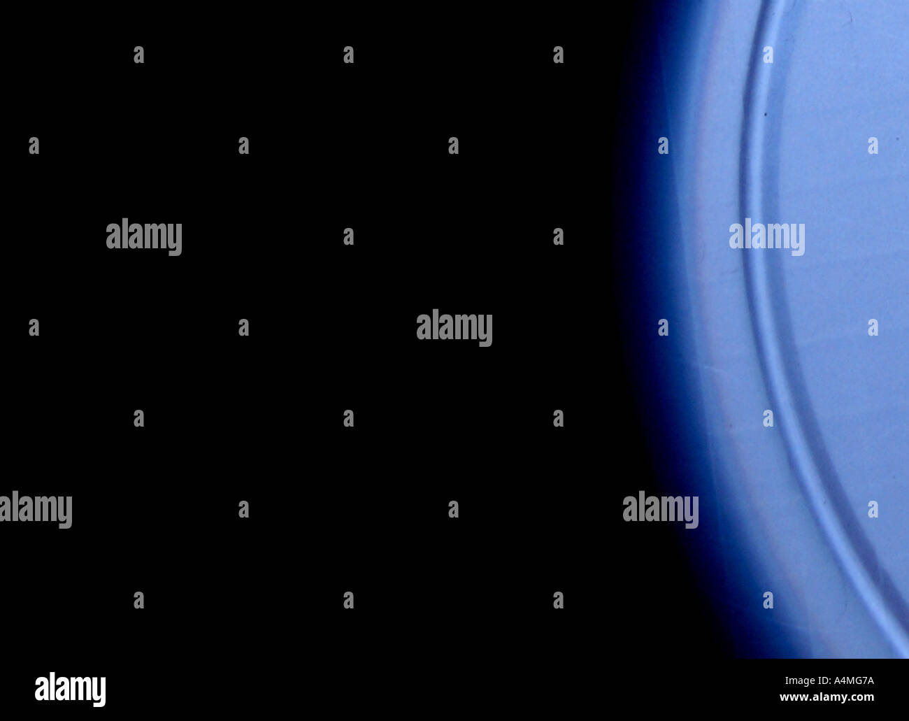 Blue disk on a black background Stock Photo - Alamy