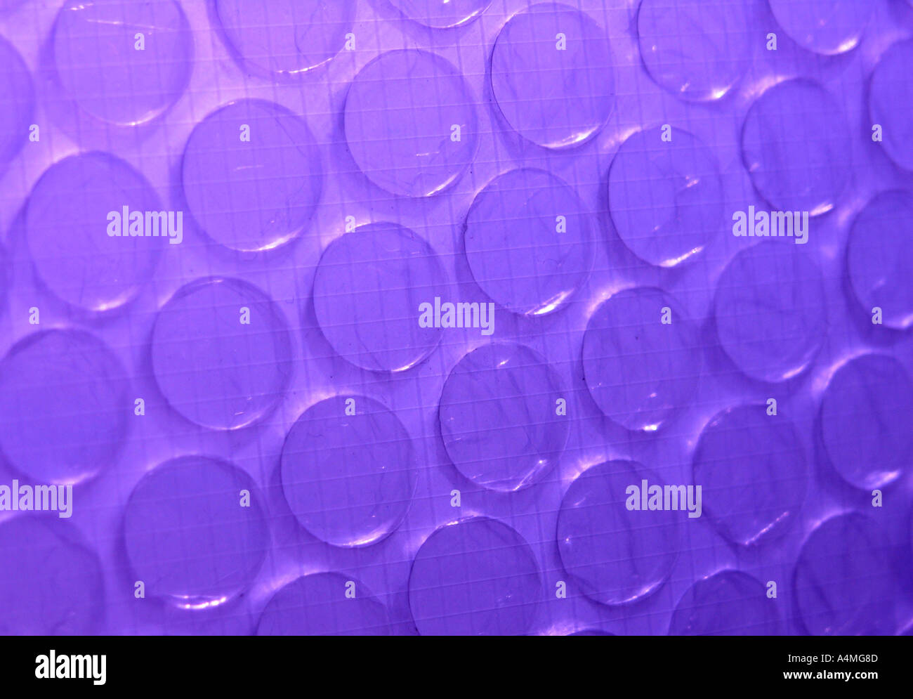 Purple plastic bubble wrap Stock Photo - Alamy