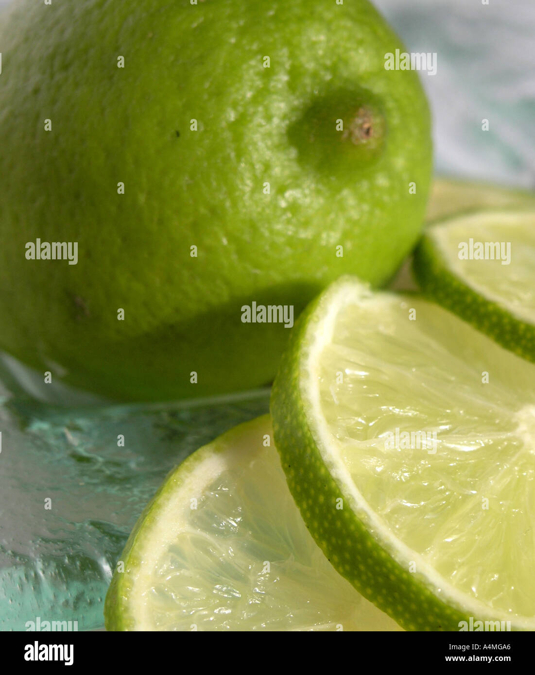 Whole and sliced fresh lime fruit Stock Photo - Alamy