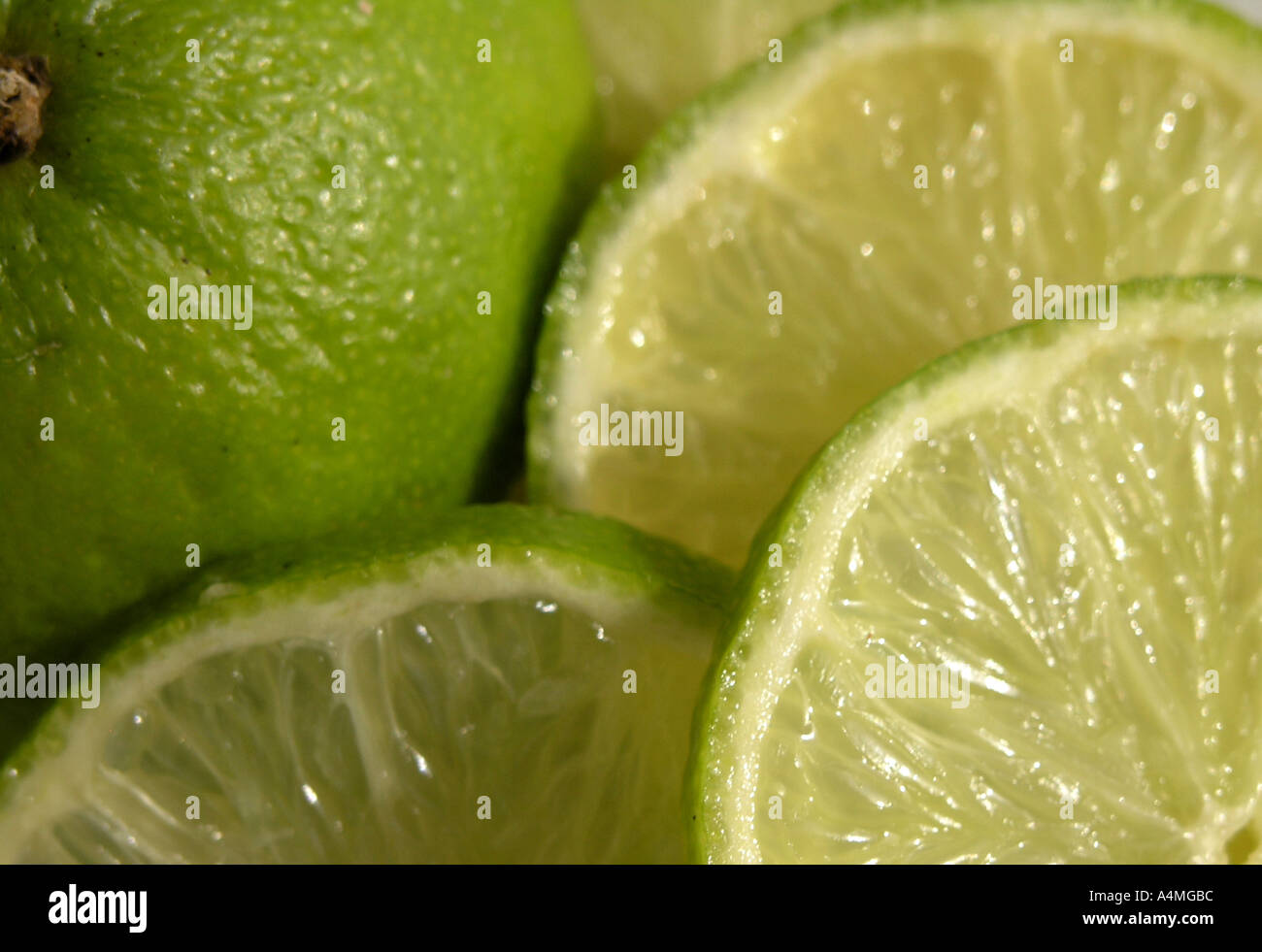 Whole and sliced fresh lime fruit Stock Photo - Alamy