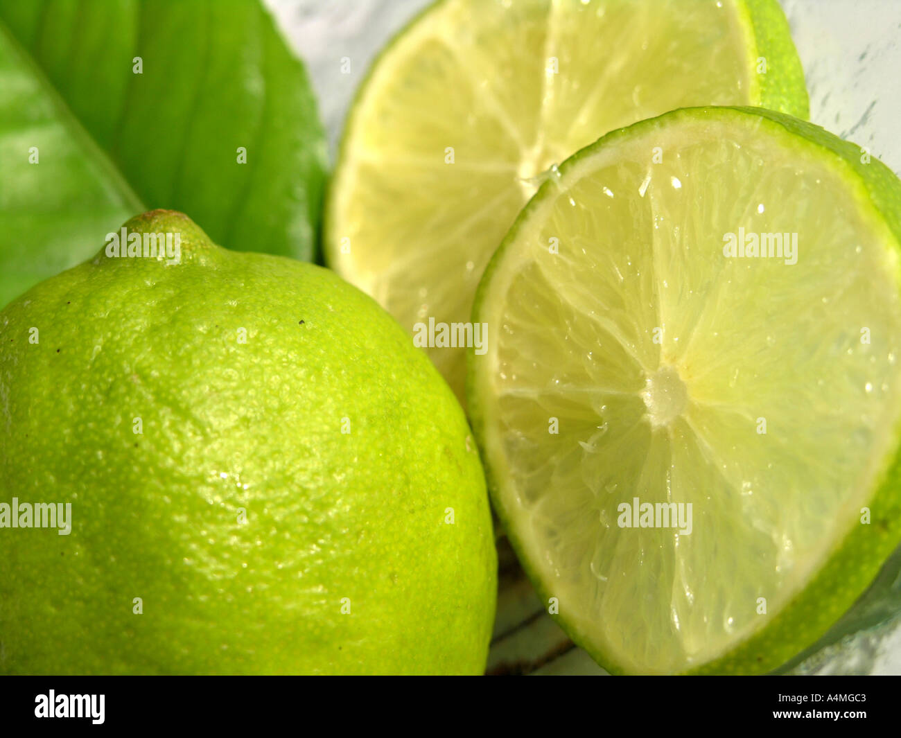 Whole and sliced lime fruit Stock Photo - Alamy
