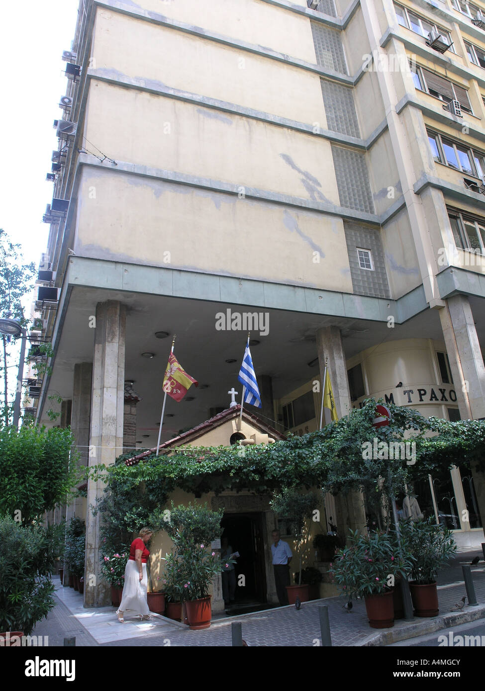 Church Agia Dinami hidden under skyscraper Stock Photo - Alamy