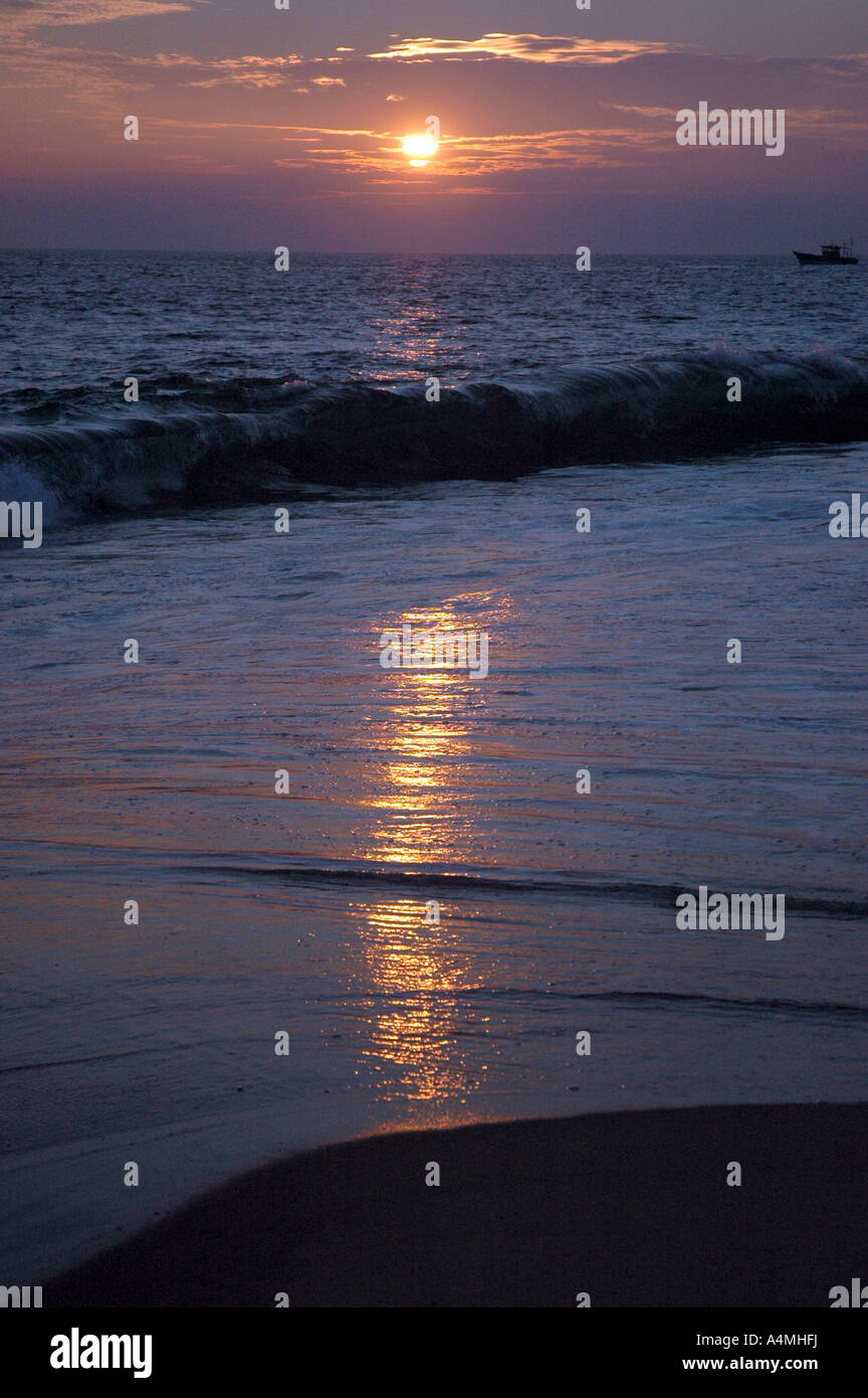 Sunset over ocean and beach in Kerala India Stock Photo - Alamy
