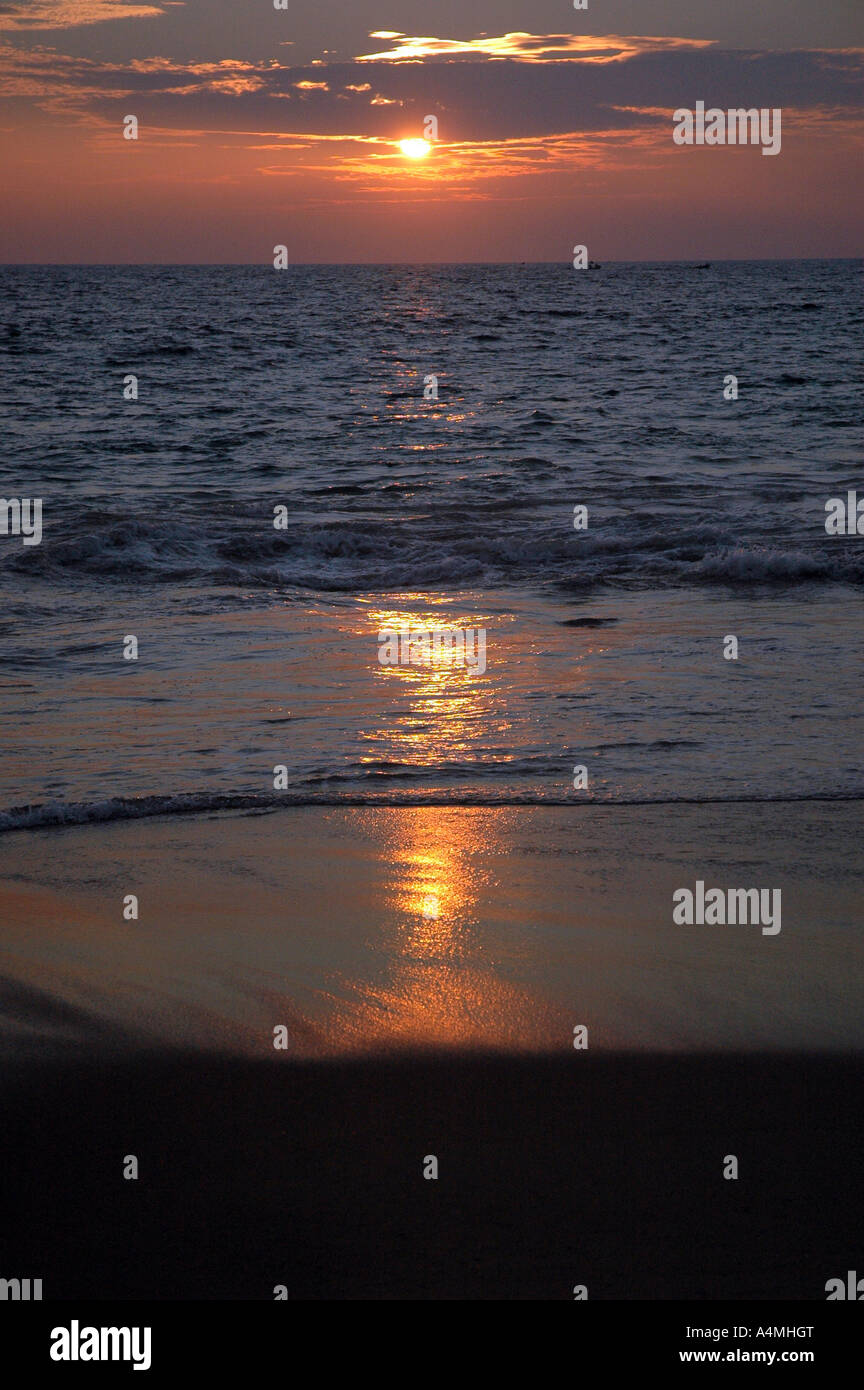 Sunset over beach and ocean in Kerala India Stock Photo - Alamy