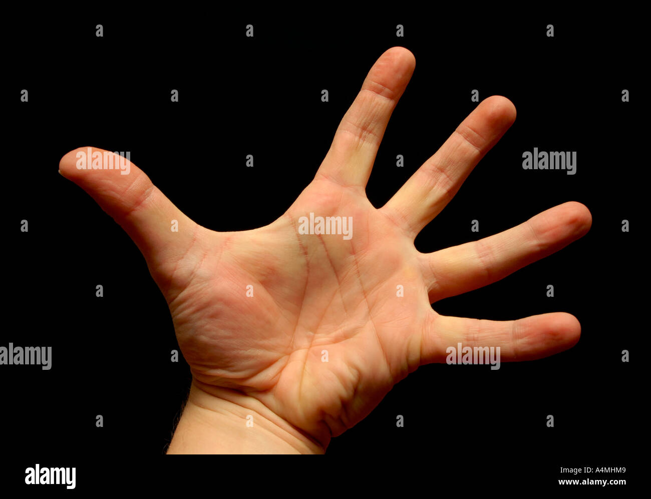 Hand on black background Stock Photo - Alamy