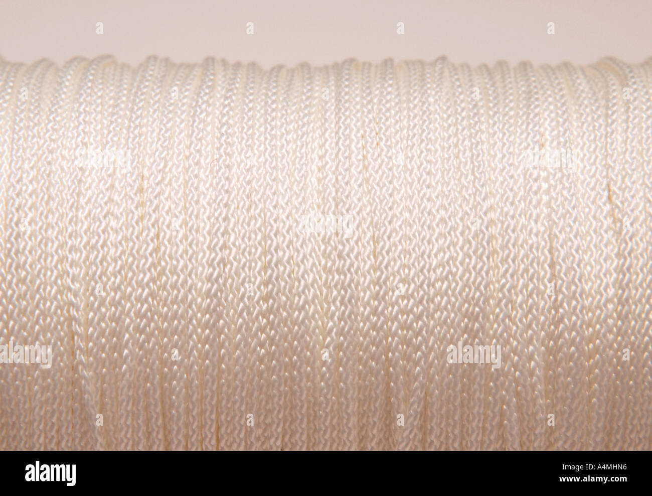 Reel of Nylon string background Stock Photo - Alamy