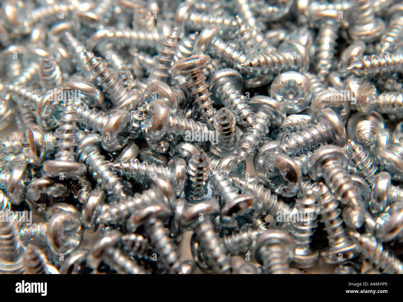 Hundreds of screws background Stock Photo - Alamy