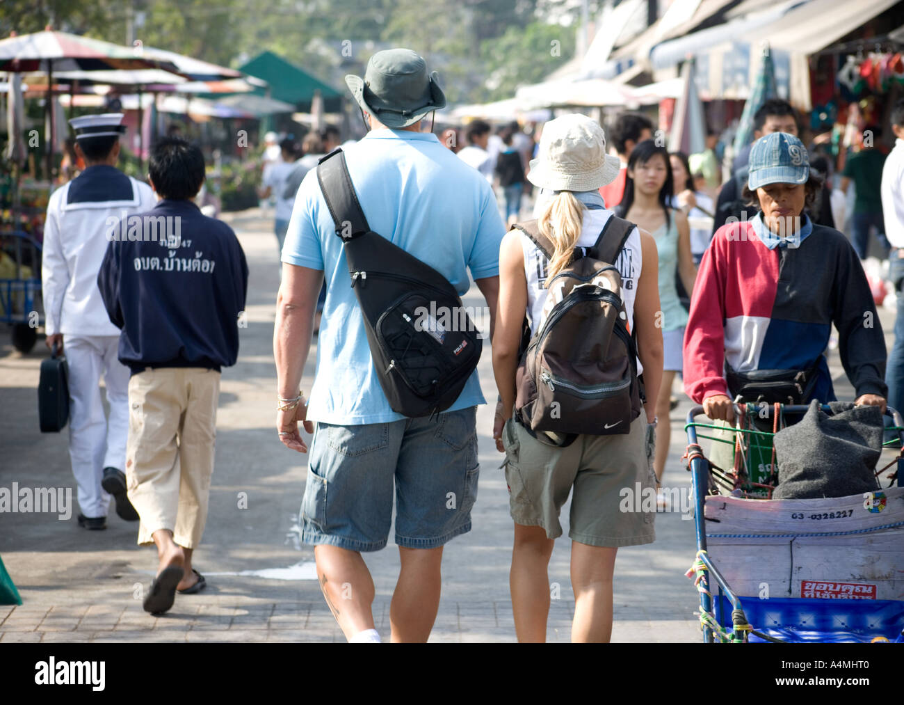 Western Tourists walking through Chatuchak Market Bangkok Thailand ...