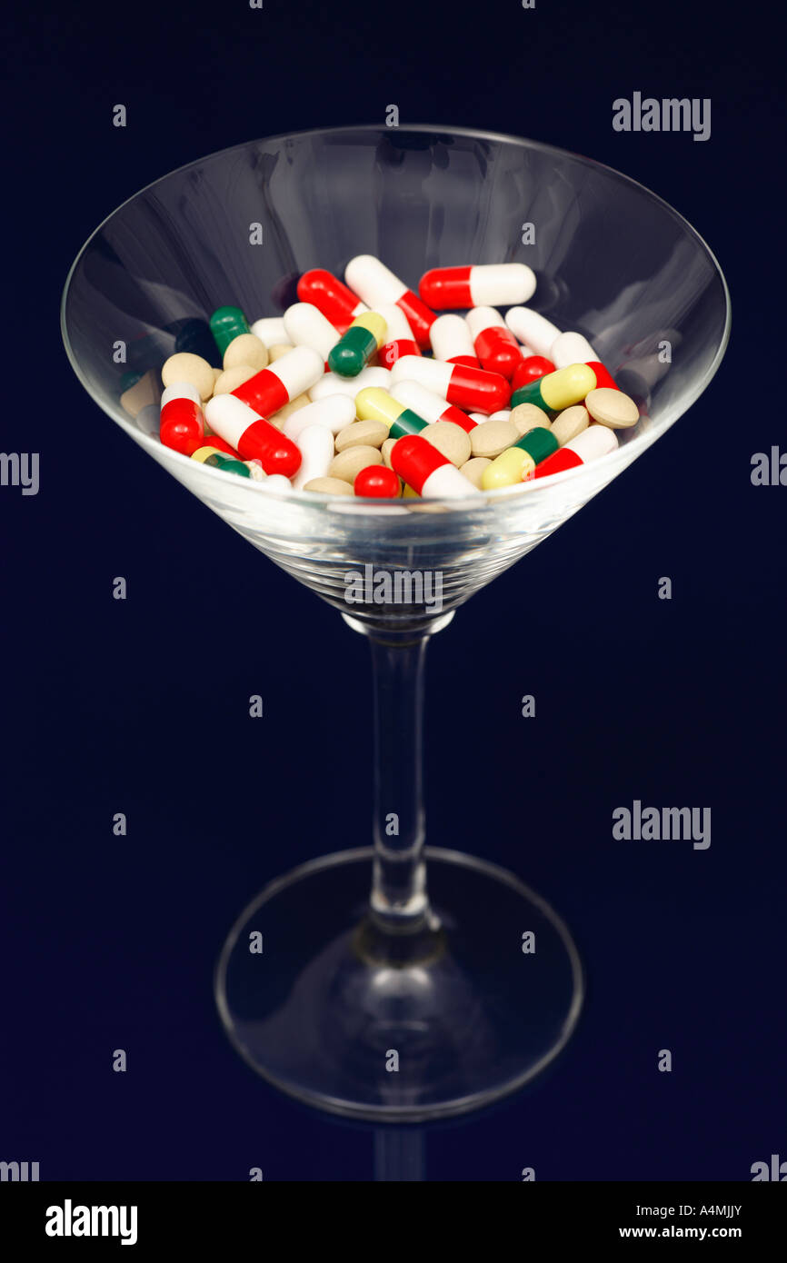Cocktail Glass Filled with Various Drugs Stock Photo - Alamy