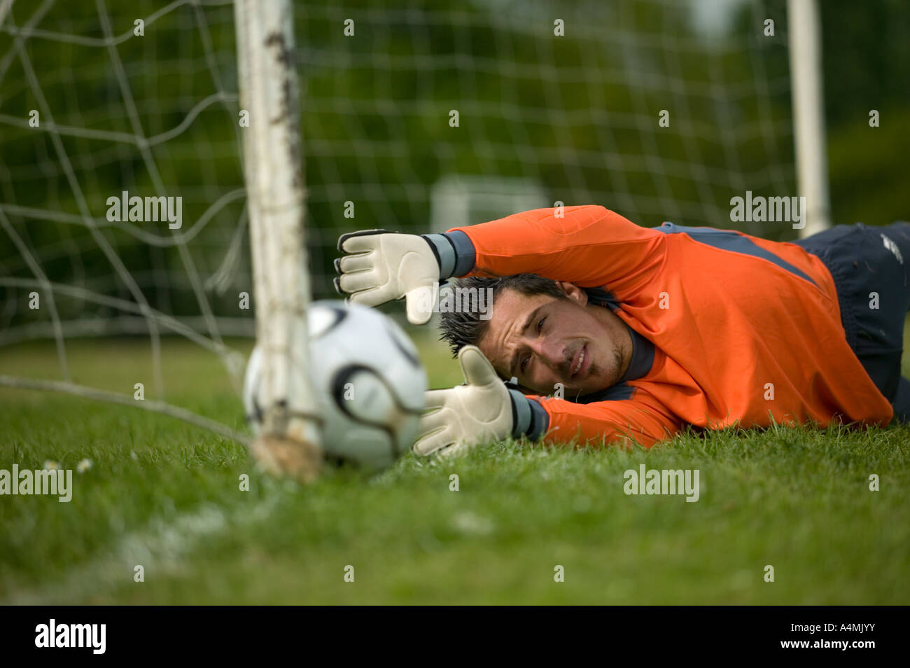 Saving a goal Stock Photo - Alamy