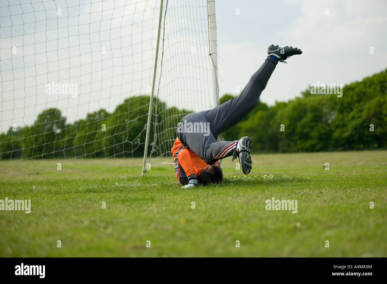 Grabbing ball with foot hi-res stock photography and images - Alamy