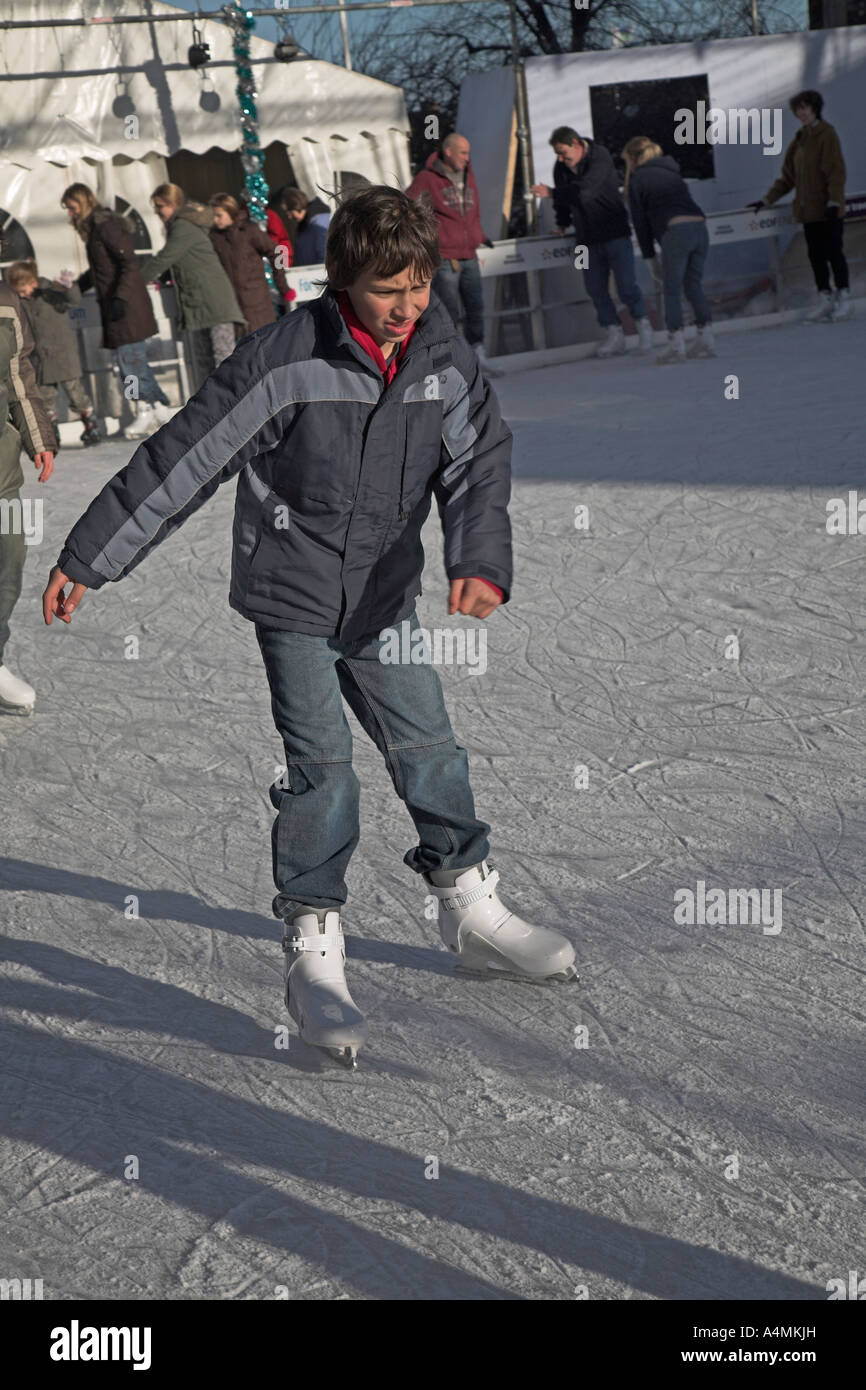 Boy ice skating at a temporary outdoors rink Norwich, Norfolk, England ...