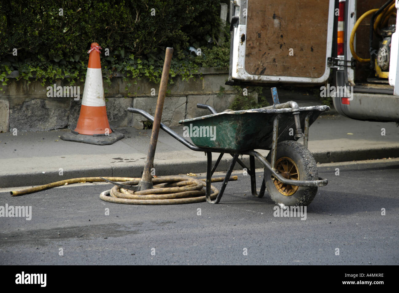 workman's tools in the road Stock Photo - Alamy