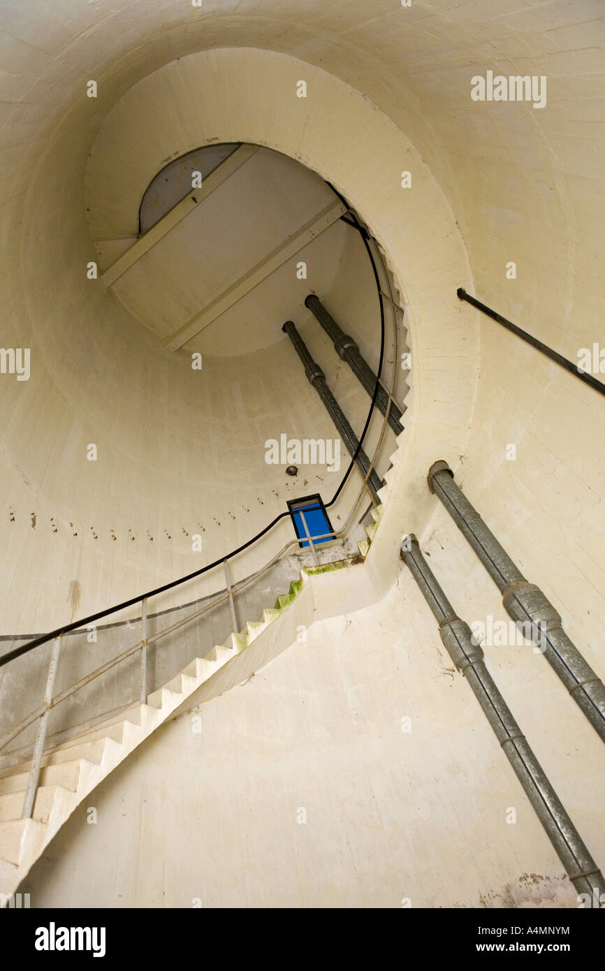 Interior of water tower showing a spiral staircase (France). Escalier ...