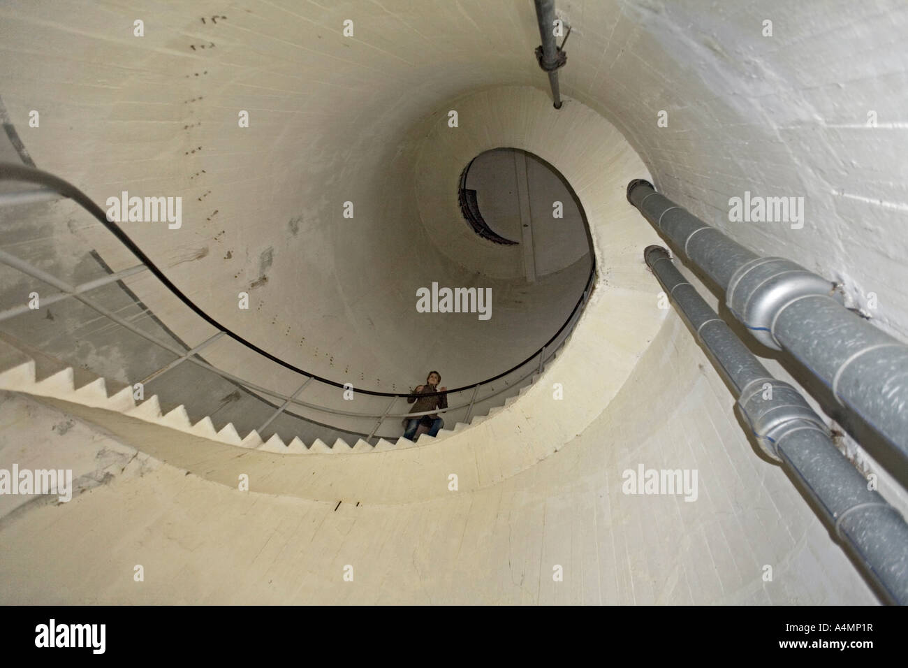 Interior of water tower showing a spiral staircase (France). Escalier ...