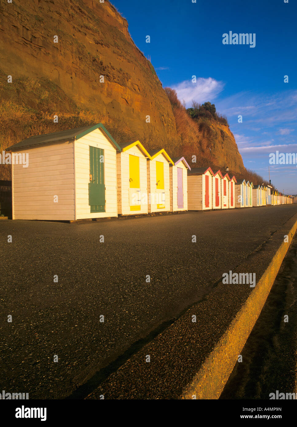 row of colourful painted beach huts on the esplanade promenade at ...