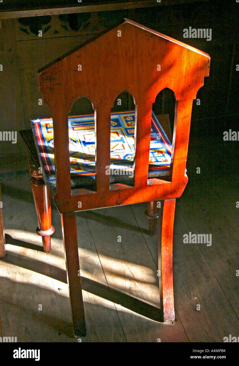Sunlight filtering through a window onto an old chair Stock Photo - Alamy