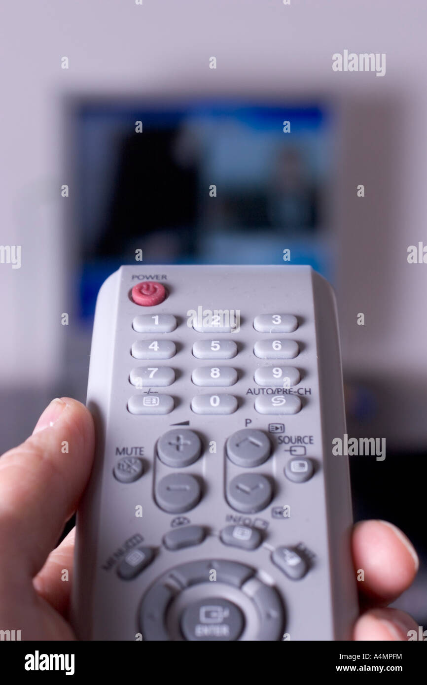 television remote control, switching channels with console Stock Photo ...