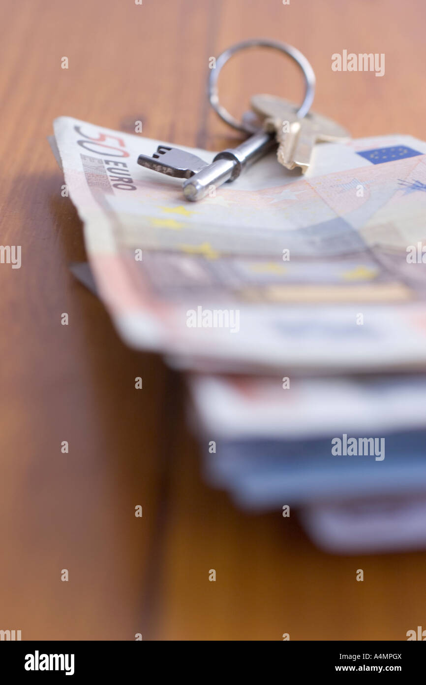 buying property in europe abroad house keys with euro notes euros Stock ...