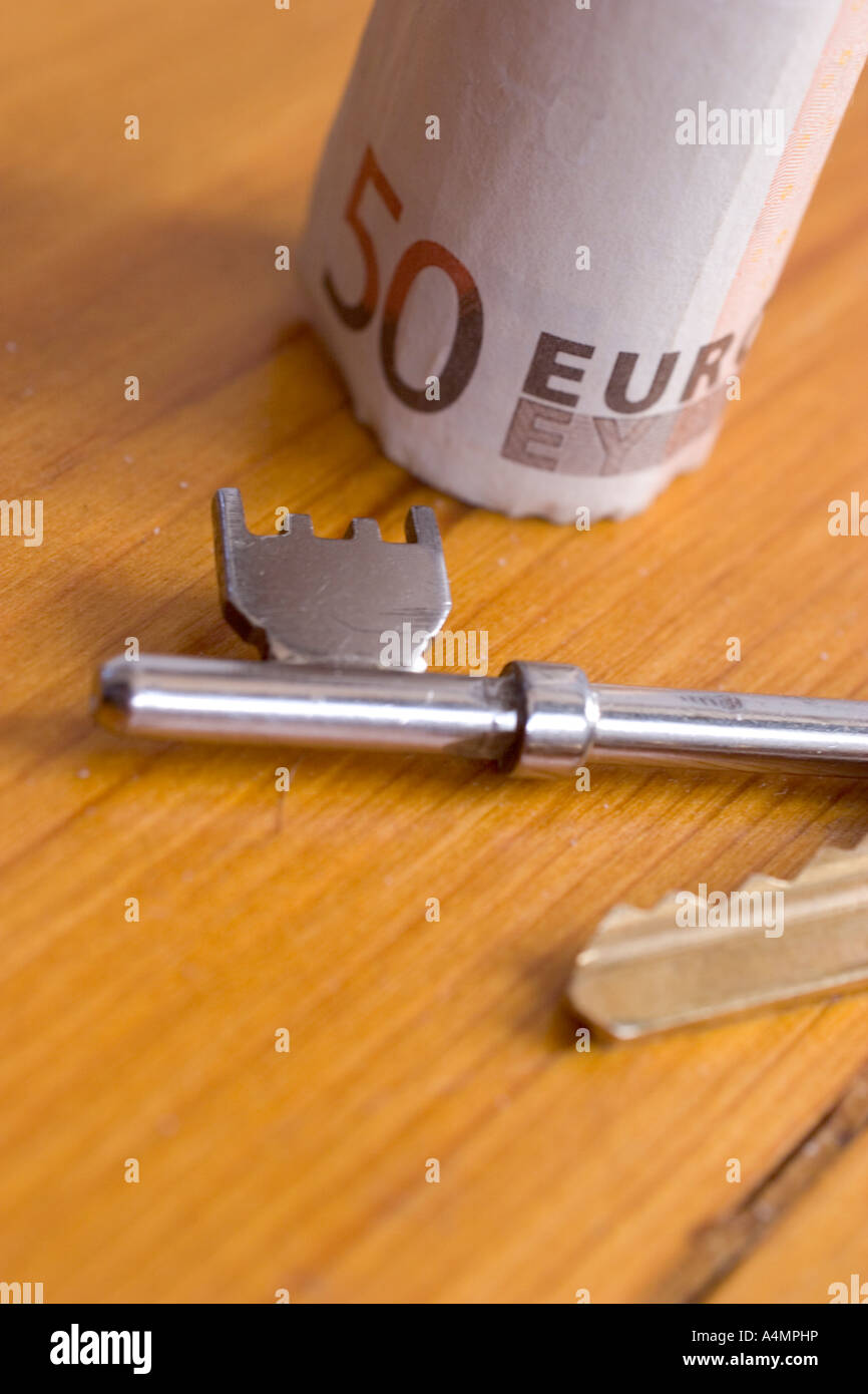 buying property in europe abroad house keys with euro notes euros Stock ...