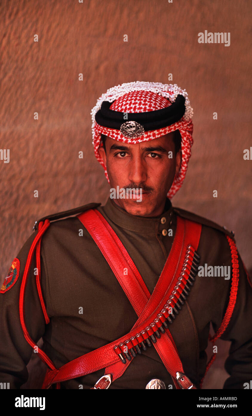 Jordanian policeman guarding the Treasury a rock carved carved tomb ...