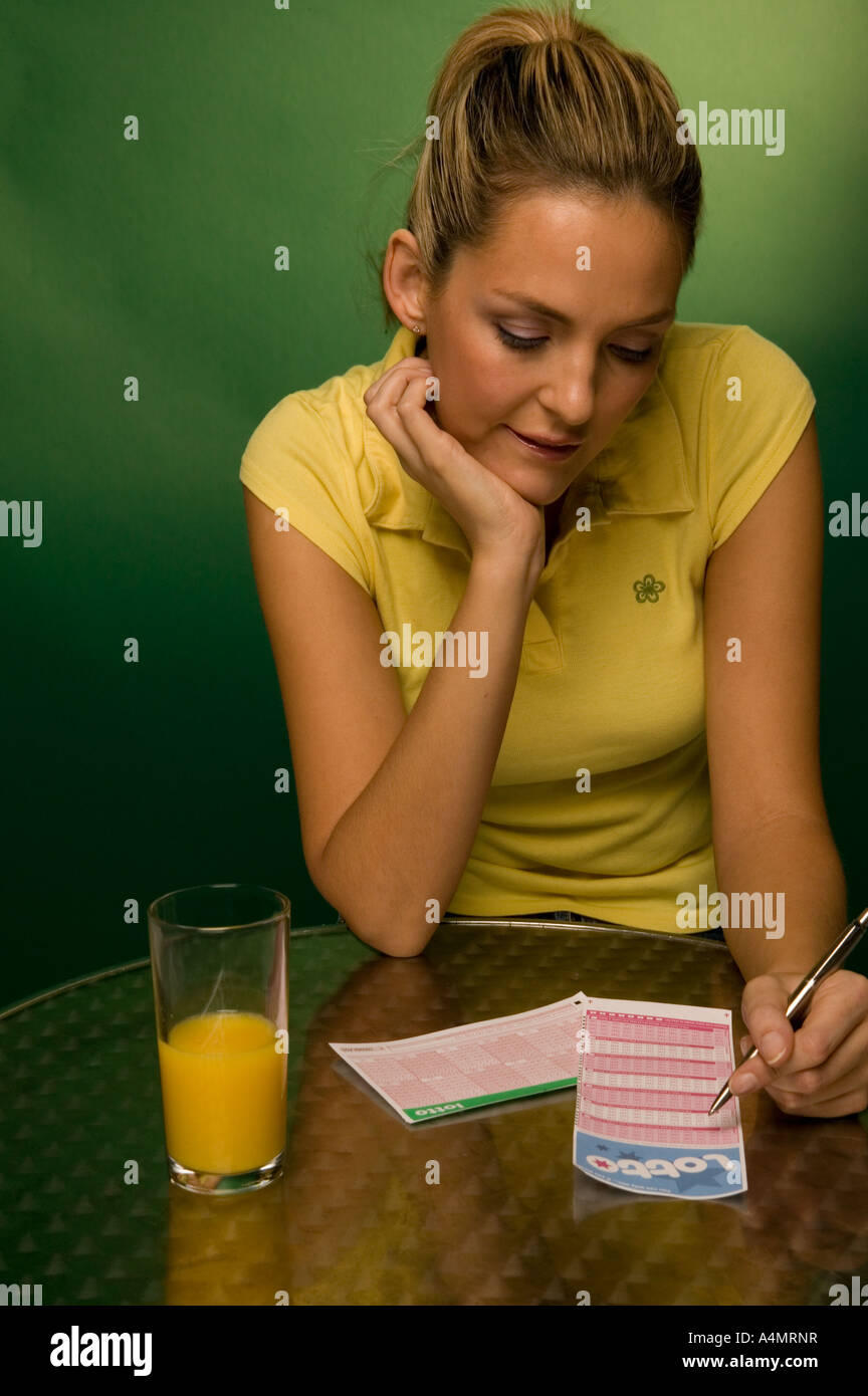 Girl playing the lottery Stock Photo - Alamy