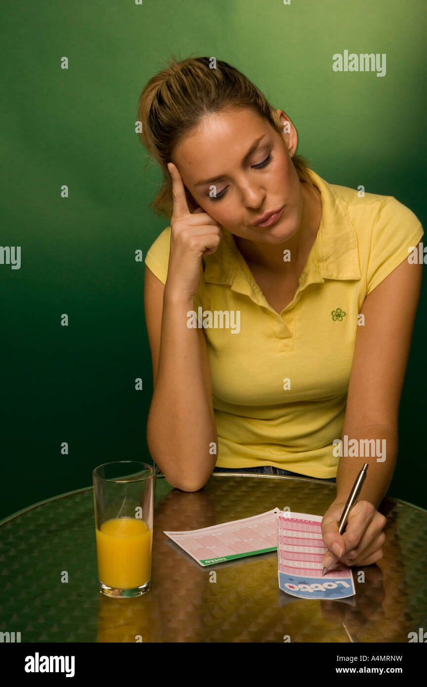 Girl playing the lottery Stock Photo - Alamy
