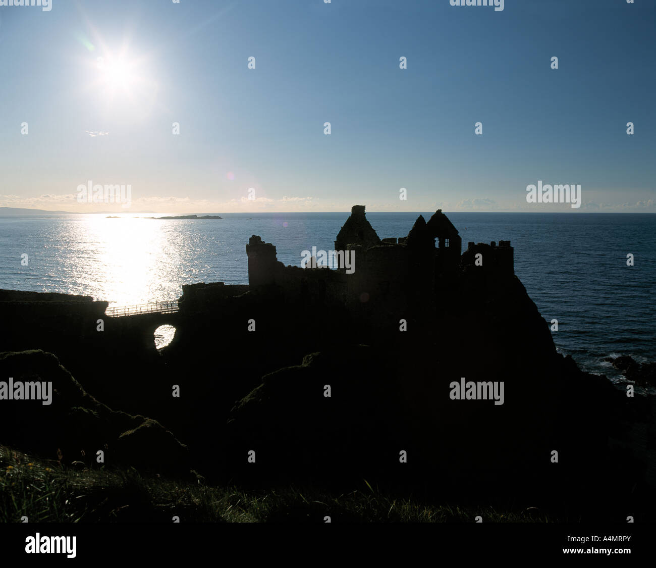 large ruined historic castle on cliff edge on irish irelands north west ...
