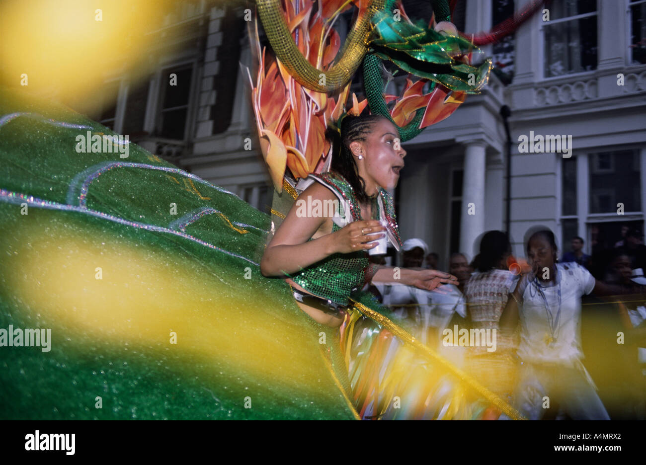 London, UK. Costumed dancer at the Notting Hill Carnival, night Stock ...
