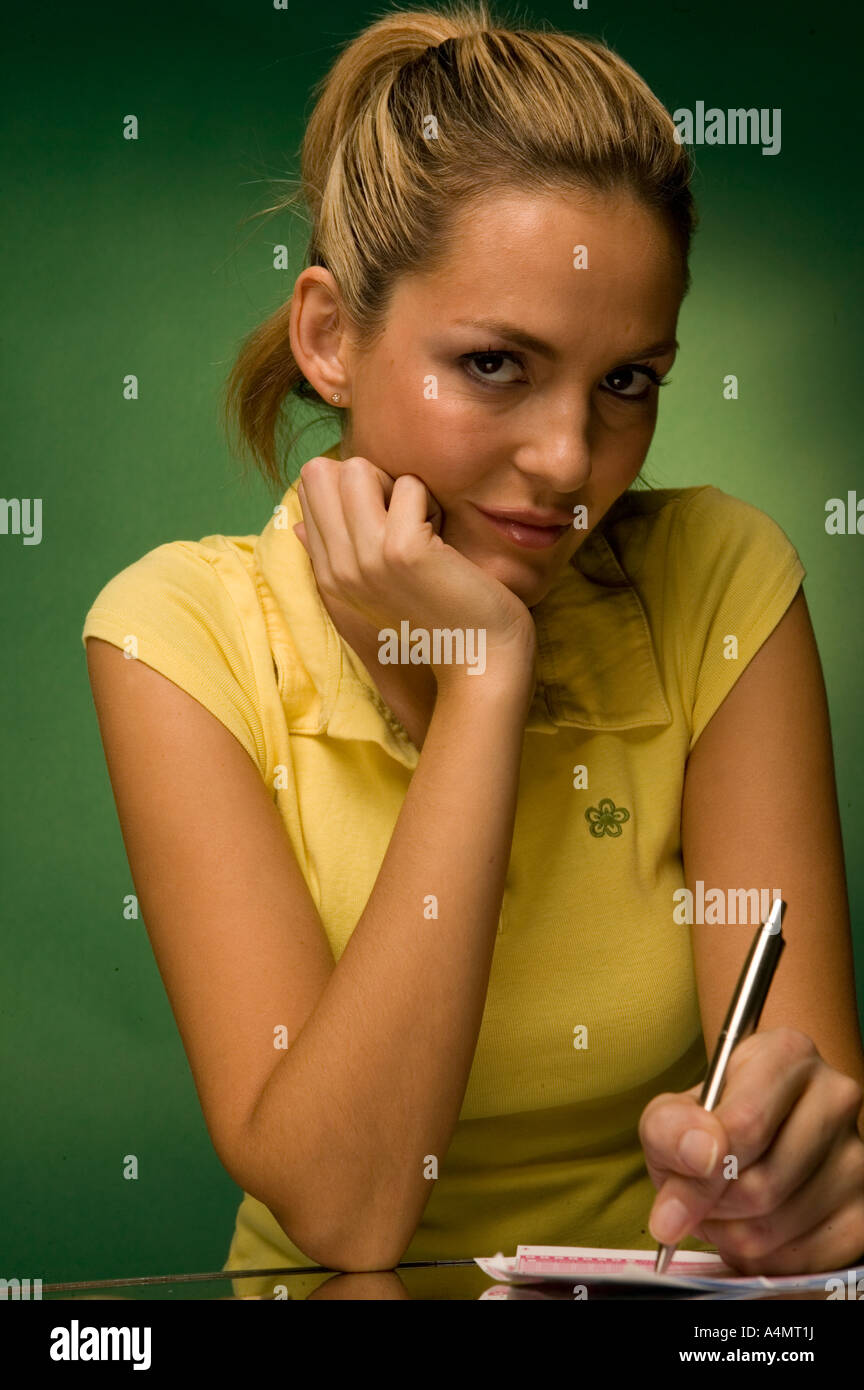 Girl playing the lottery Stock Photo - Alamy