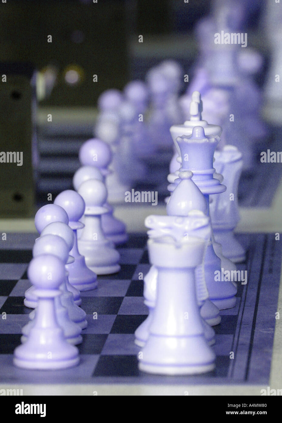 Chess set pieces lined up ready to play in a match room competition ...