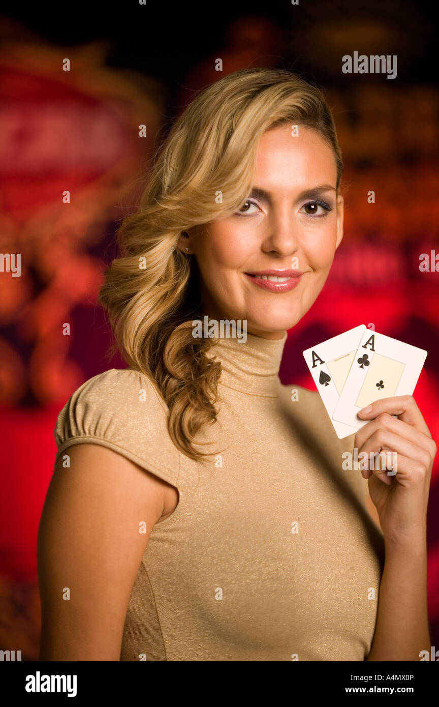 Portrait of a model holding playing cards Stock Photo - Alamy