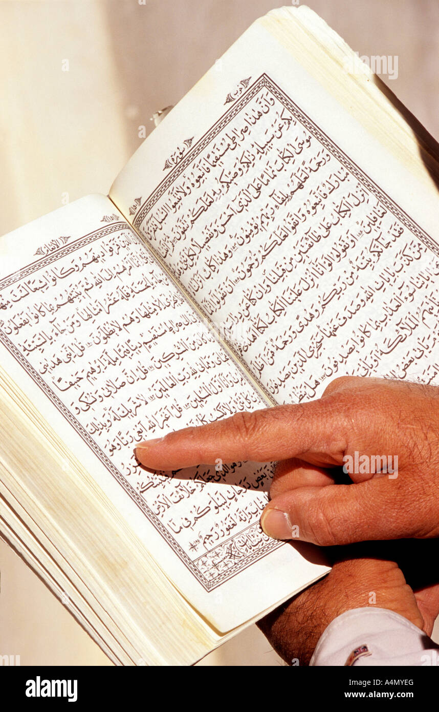 A man reading the Koran, Iran Stock Photo - Alamy