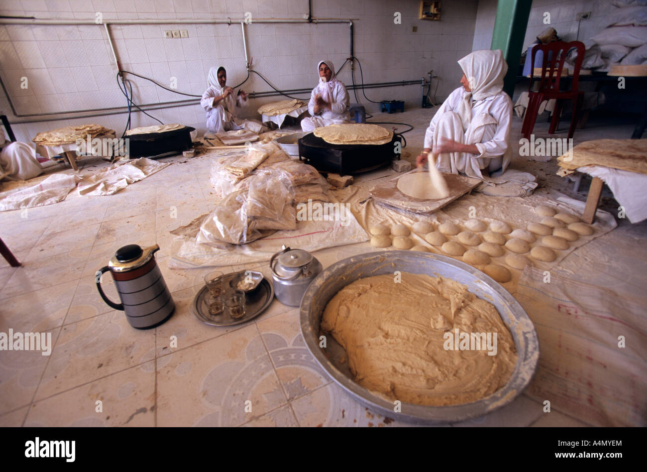 Women making bread in a traditional Baker's shop, Iran Stock Photo - Alamy