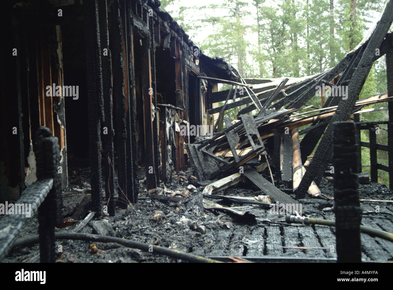 Fire fighters from several agencies investigate the cause of a ...