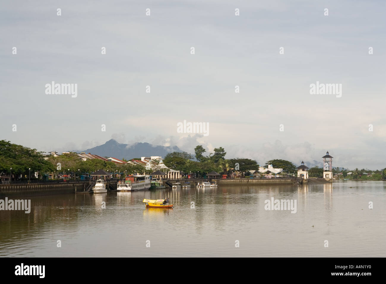 Malaysia Borneo Sarawak Kuching waterfront with Gunung Serapi in cloud ...